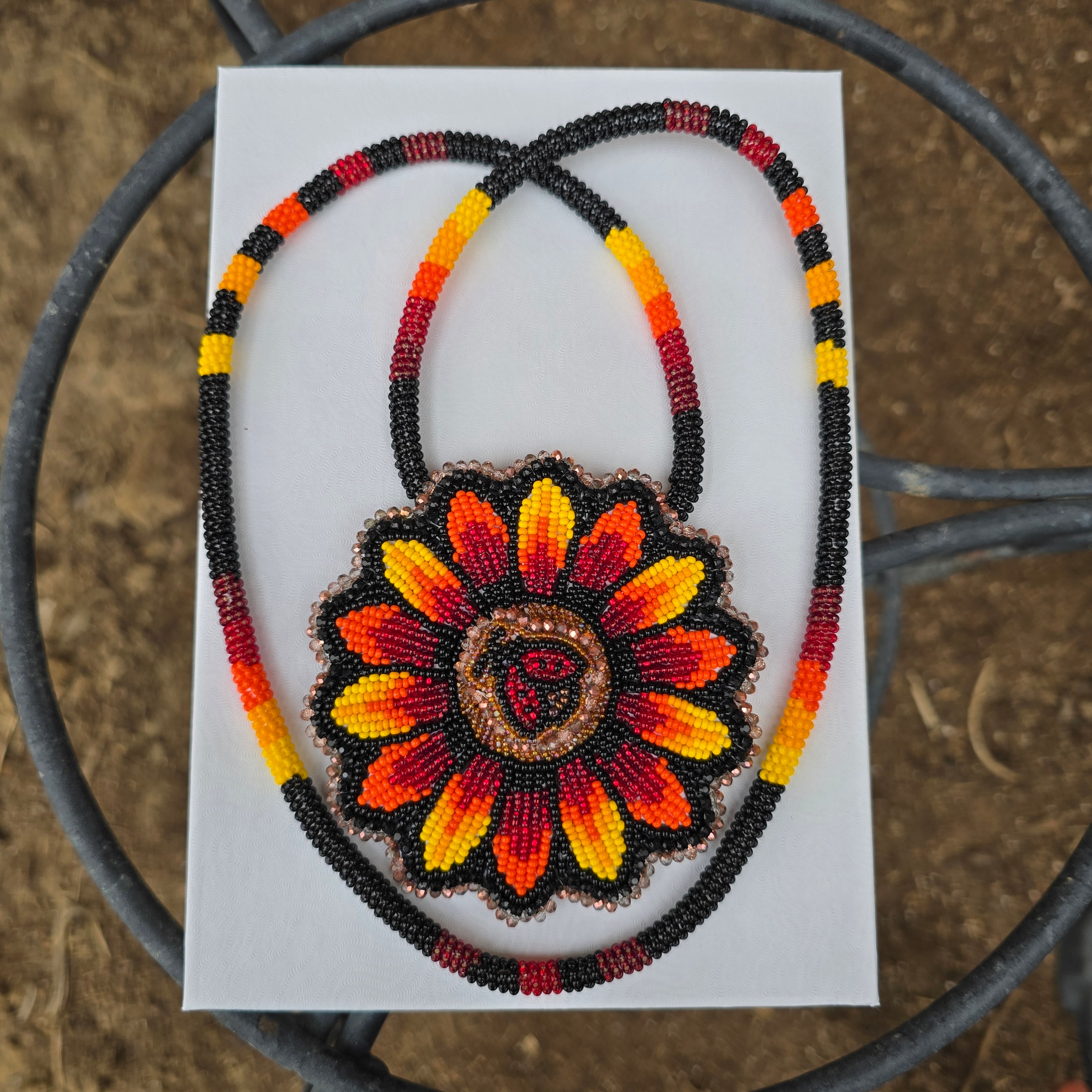 Sunflower with spinning Lady bugs medallion. – RBHBeadwork